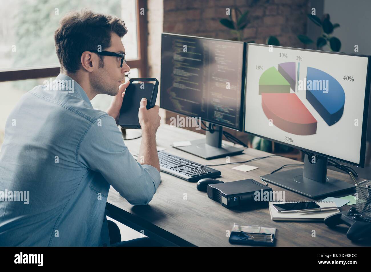 Profile side photo of focused guy it specialist sit desk work pc look ...