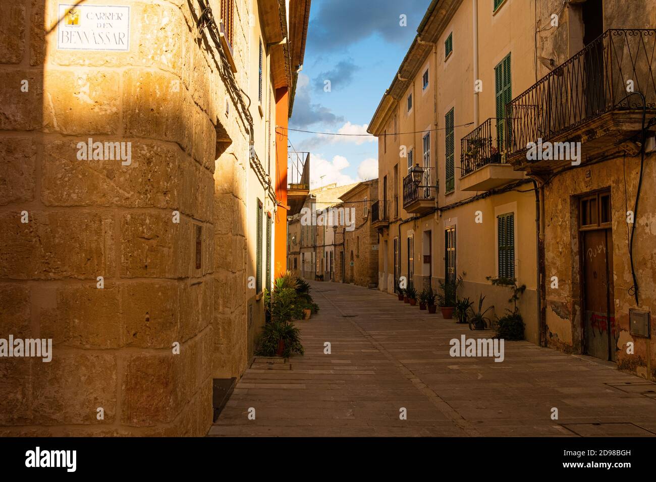 empty street in alcudia at sunset, a traditional old spanish town with ...