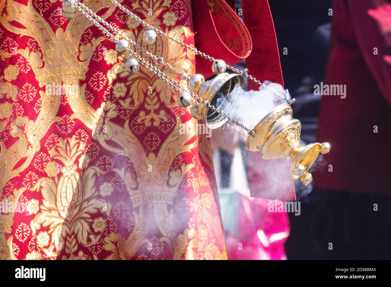 A smoking censer in the hand of an Orthodox Christian priest in an ...
