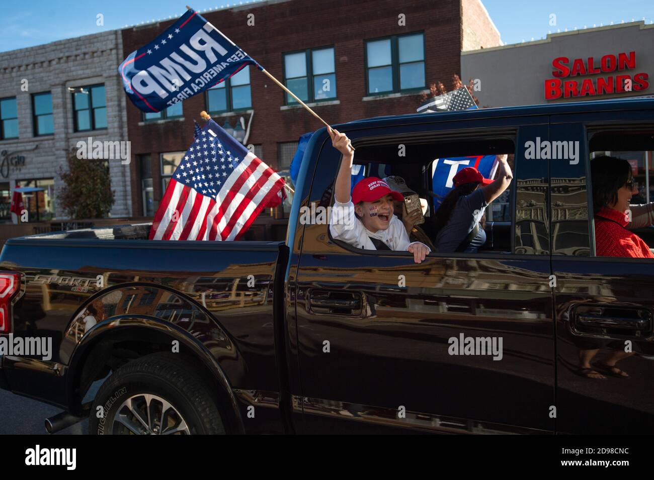 Manhattan, Kansas, USA. 1st Nov, 2020. Children wave a Trump flag out ...