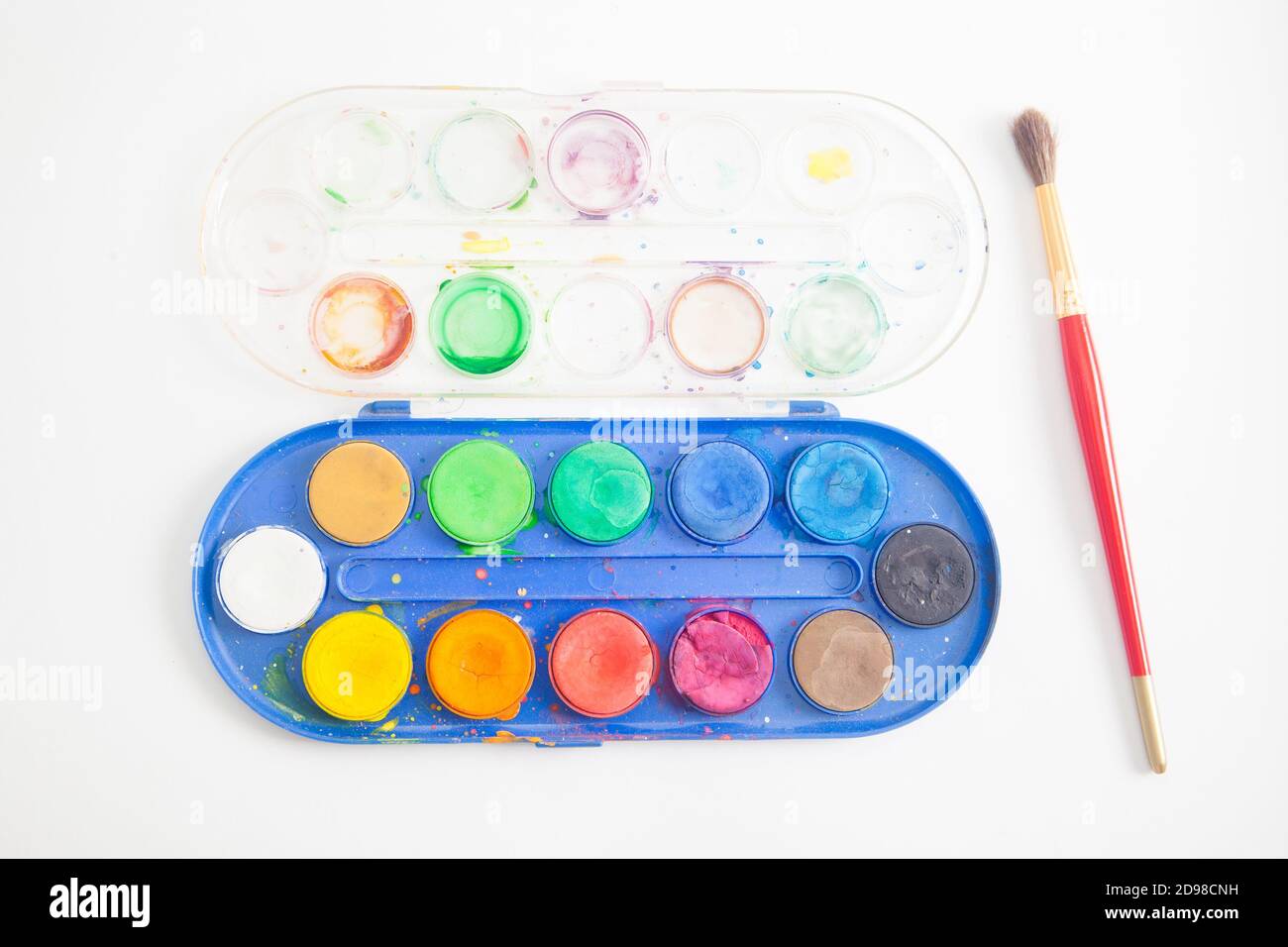Used watercolor paint palette with red brush on white background Stock ...