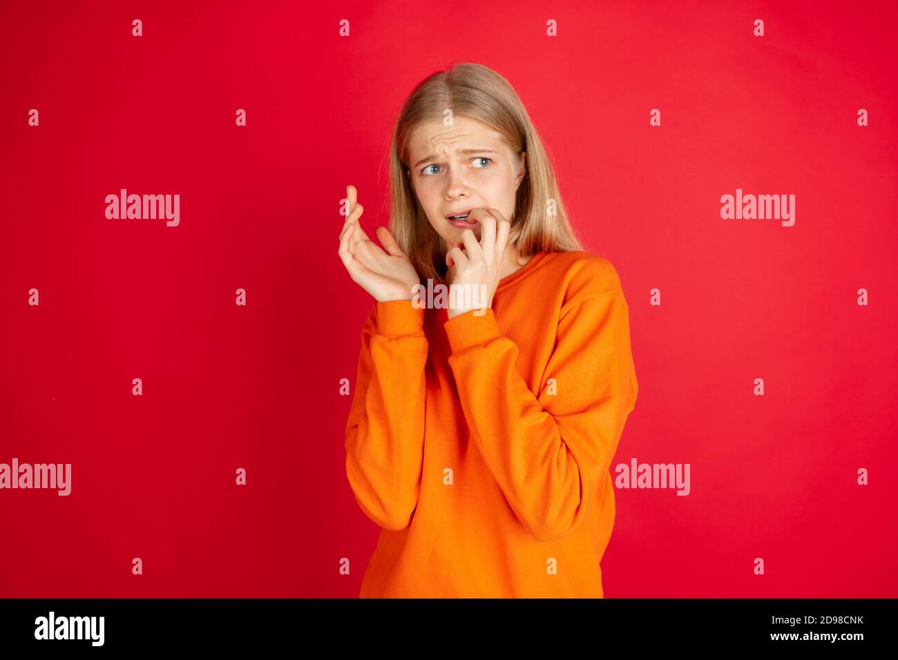Scared, asking looking. Portrait of young caucasian woman isolated on ...