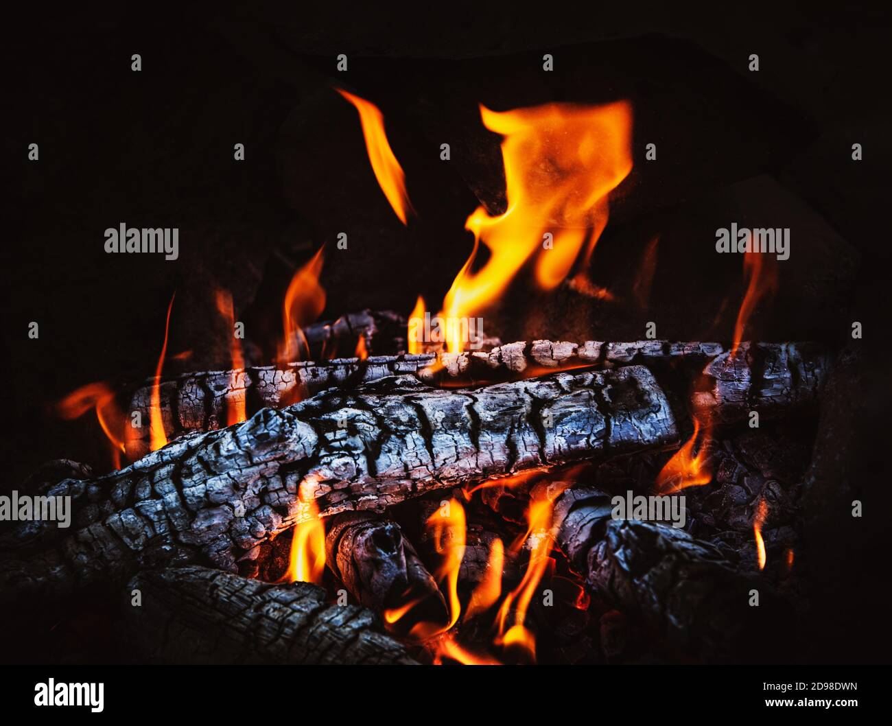 Wood fire with ash, сloseup. Beautiful fire with flames charred wood ...