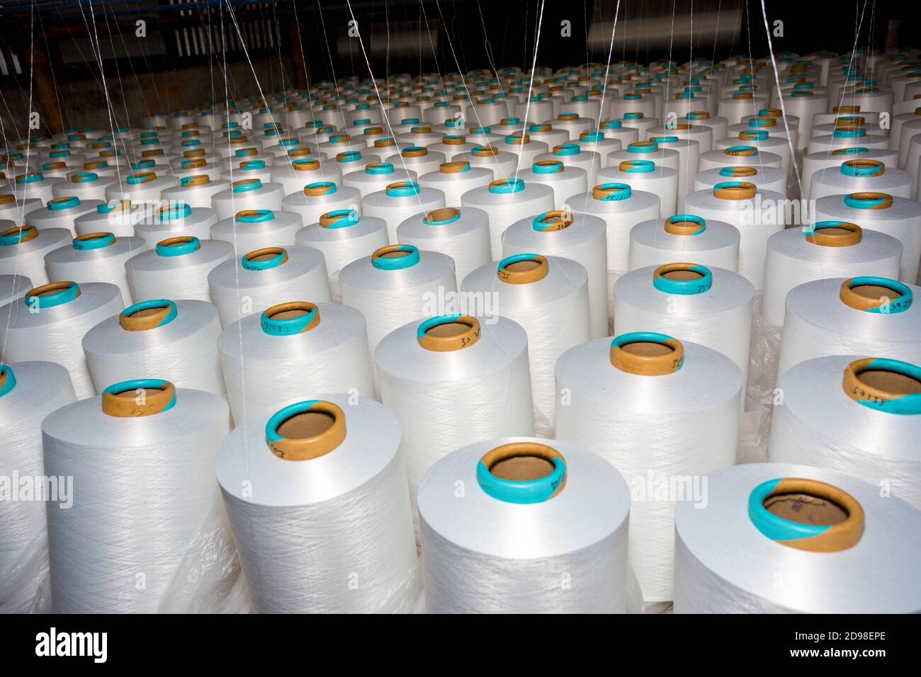 A pattern of white cotton spools with threads. An old system manual ...