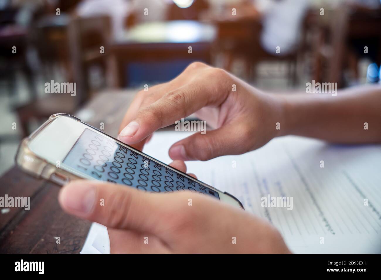 Student doing educational exam test by smartphone with stress Stock ...
