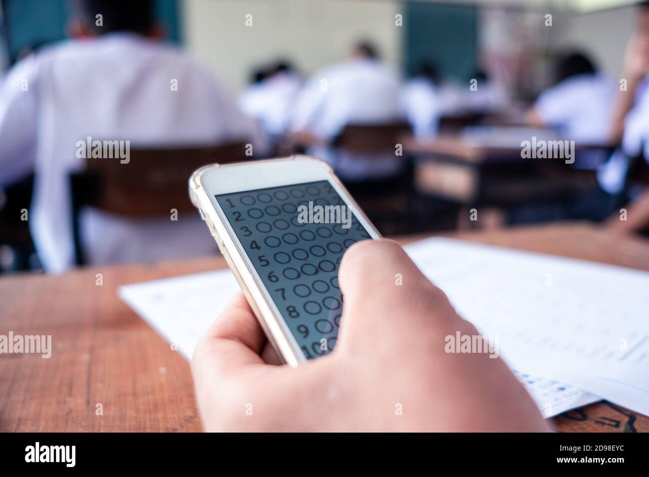 Student doing educational exam test by smartphone with stress Stock ...