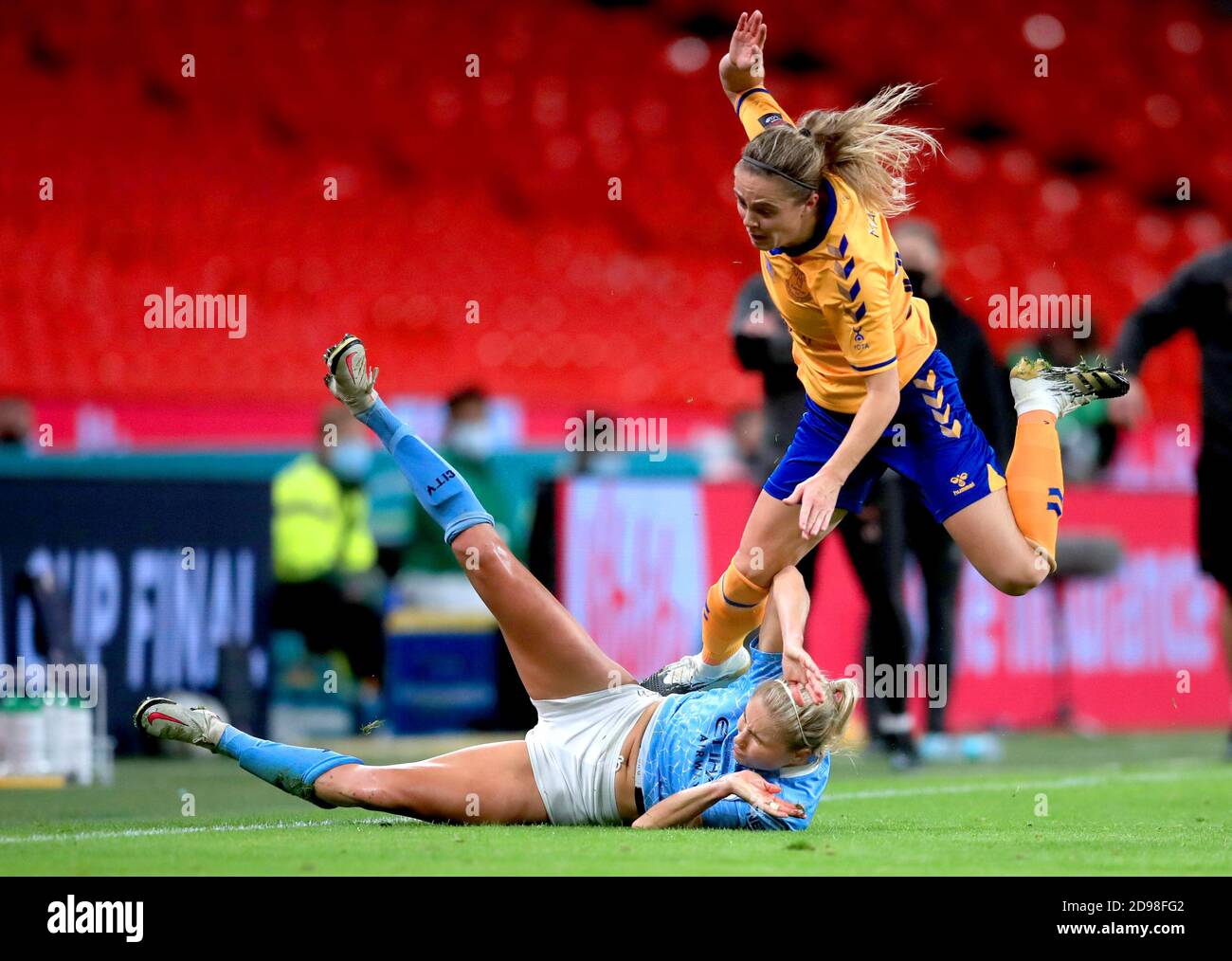 Manchester City's Steph Houghton (floor) and Everton's Simone Magill ...