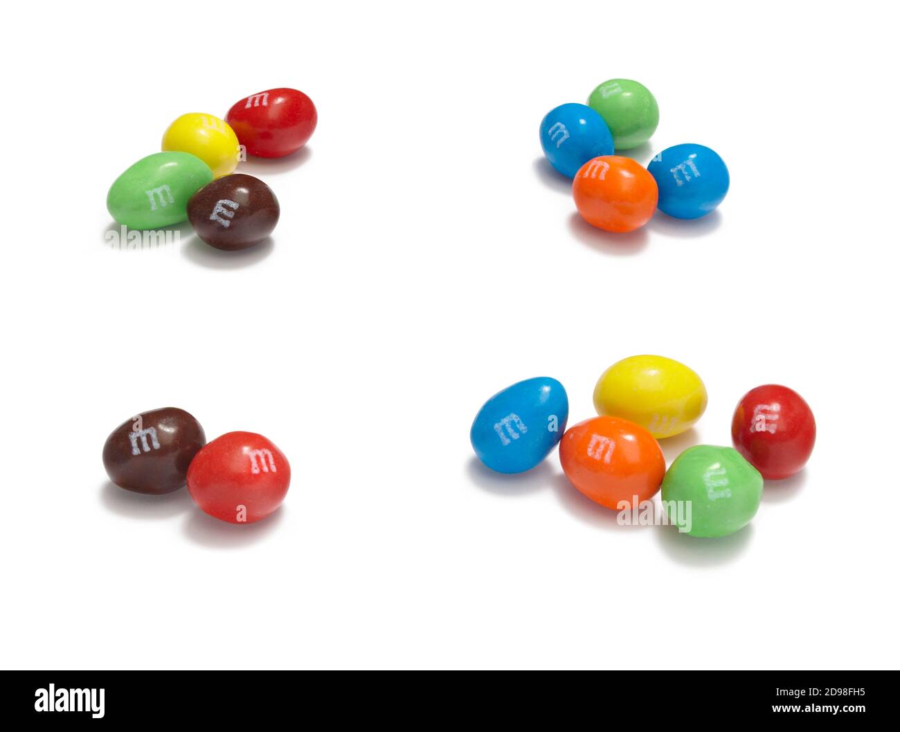 four groups of m&m candies photographed on a white background Stock ...