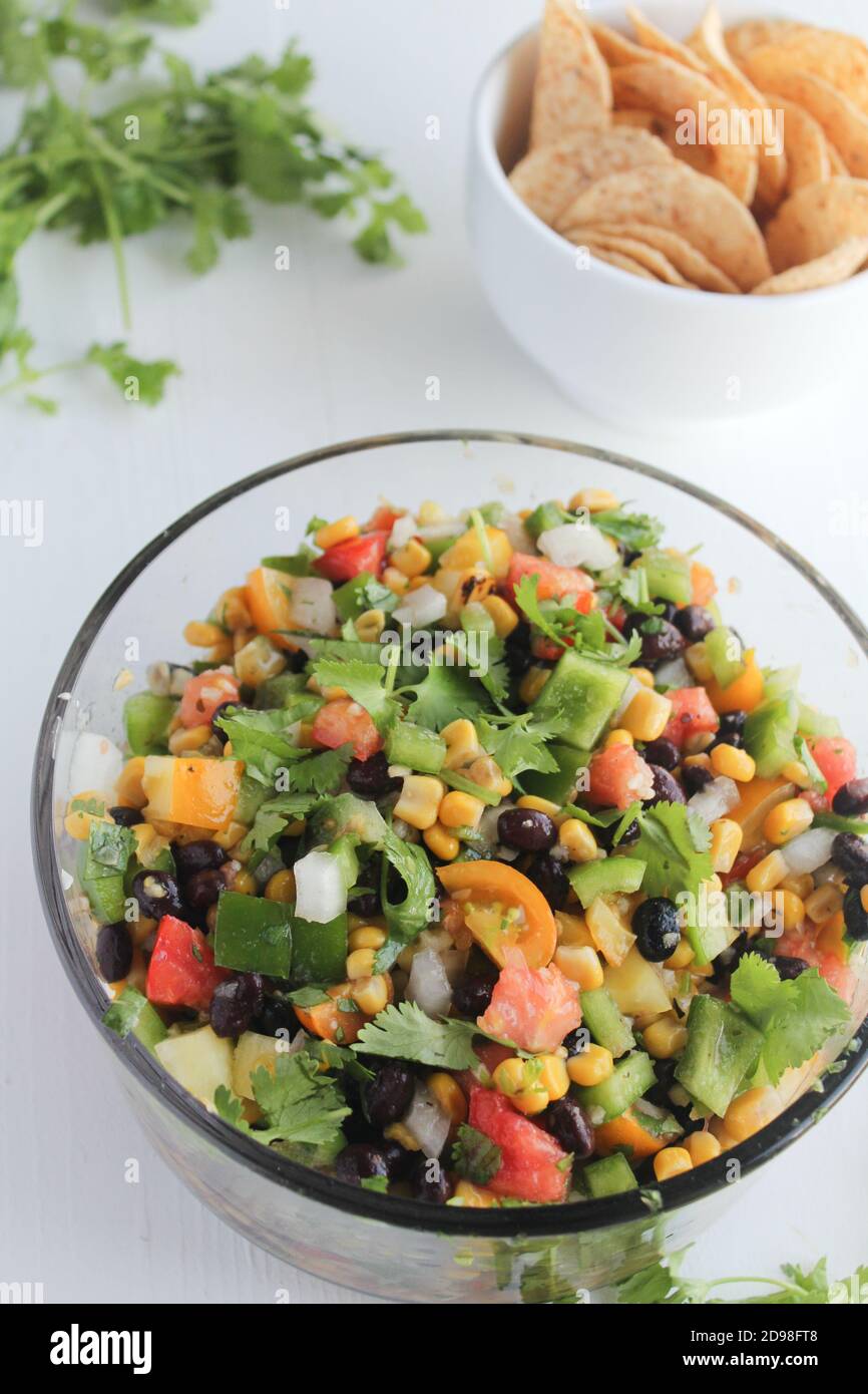 Fiesta salsa bowl with cilantro and tortilla chips Stock Photo - Alamy