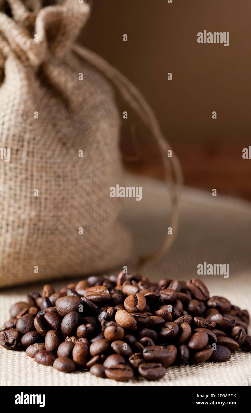 cloth sacks (raffia), with coffee beans and brown background Stock ...