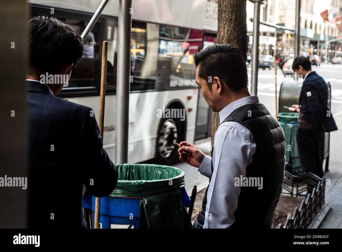 Asian guys on smoking break Stock Photo - Alamy