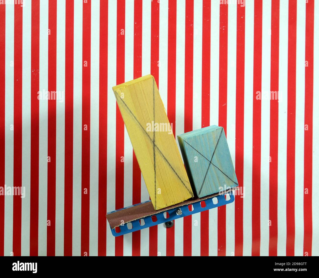 Colorful wood blocks of different size placed on a board that ...