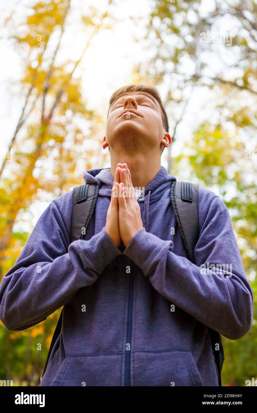 Praying in nature hi-res stock photography and images - Alamy