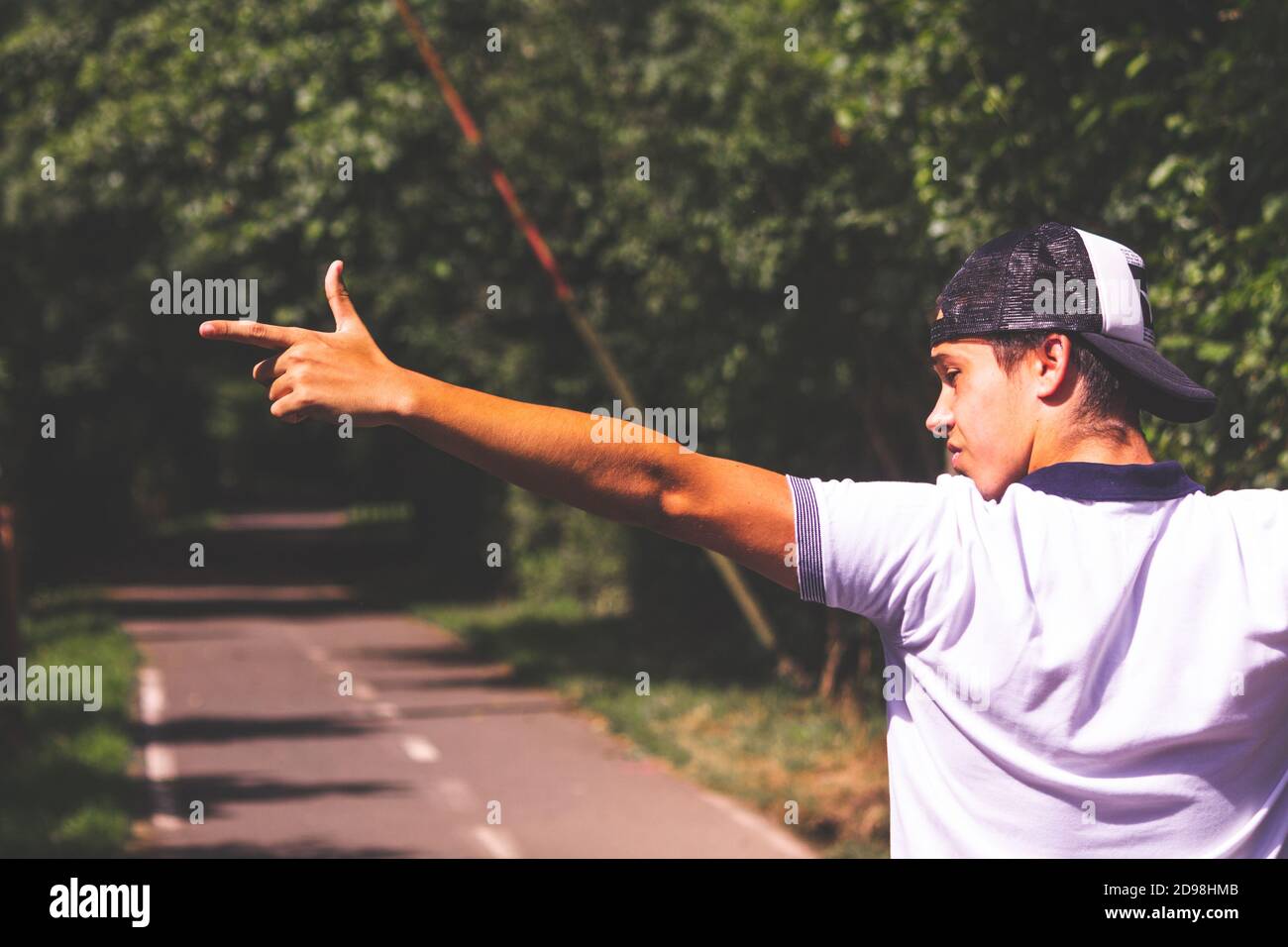 Man arm pointing left Stock Photo - Alamy