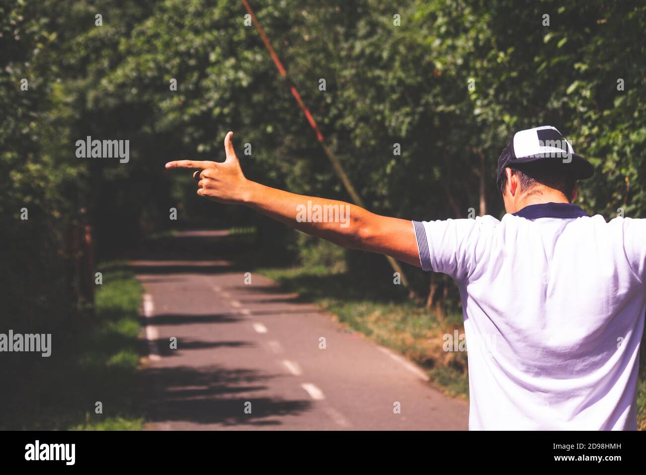 Man arm pointing left Stock Photo - Alamy