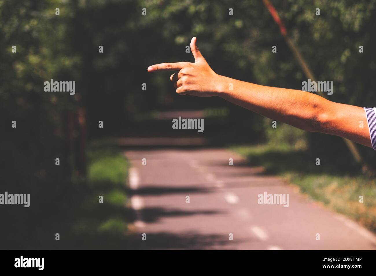 Man arm pointing left Stock Photo - Alamy