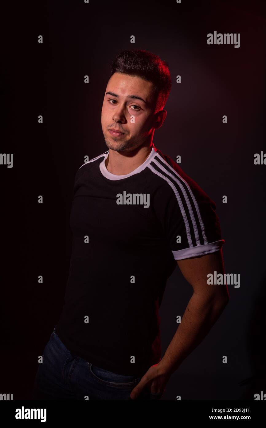 Handsome man posing at a studio Stock Photo - Alamy
