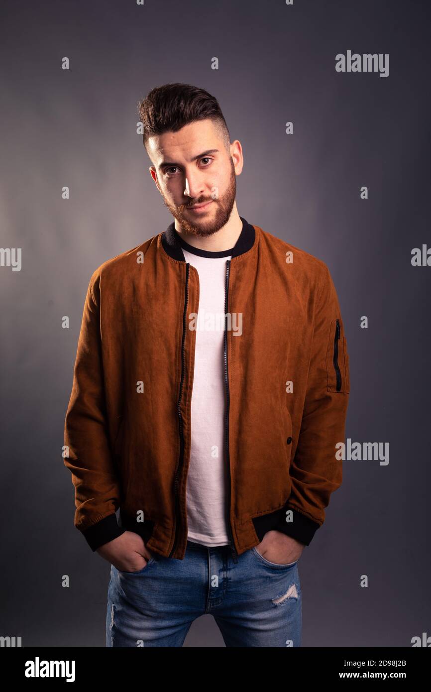 Handsome man posing at a studio Stock Photo - Alamy