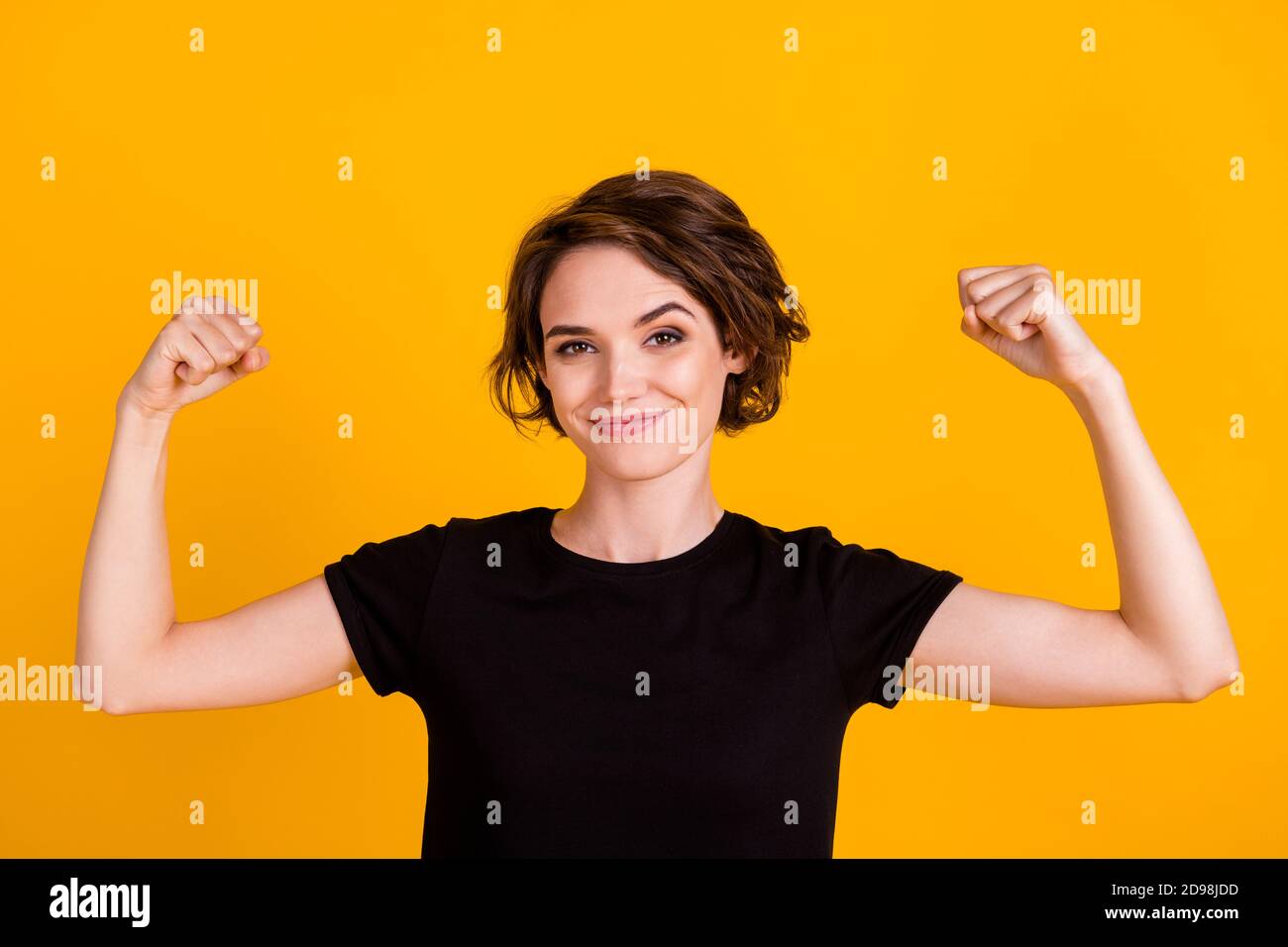 Strong woman demonstrating her muscles hi-res stock photography and ...