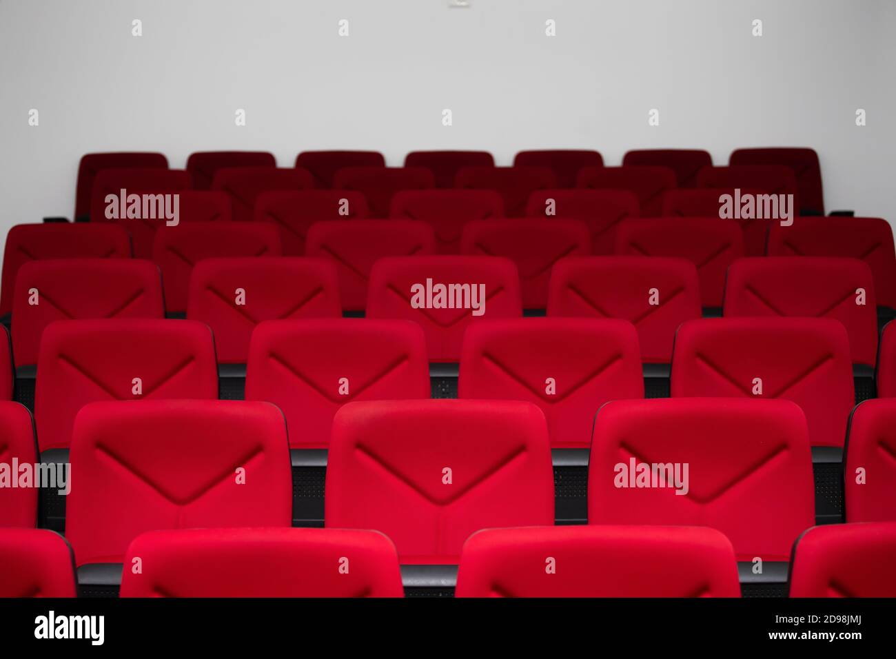 Empty comfortable red seats in cinema Stock Photo - Alamy