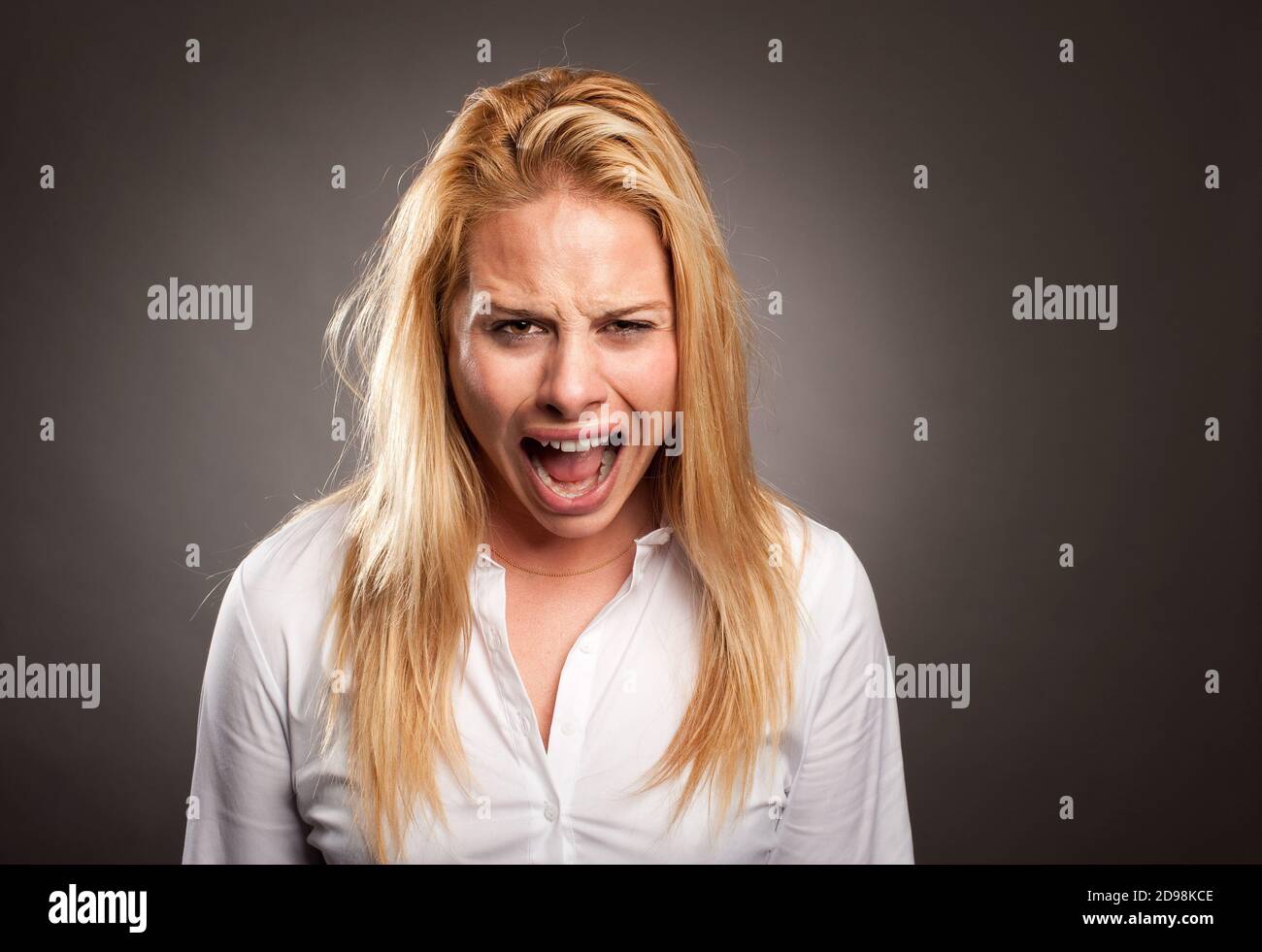portrait of woman with angry expression Stock Photo - Alamy