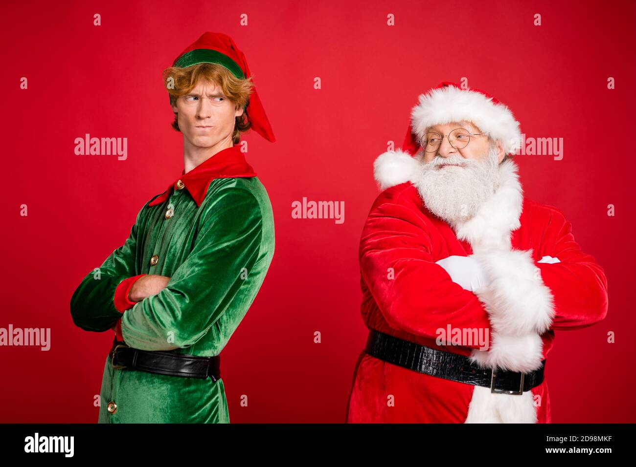 Profile photo of two people santa claus elf folded arms angry argument ...