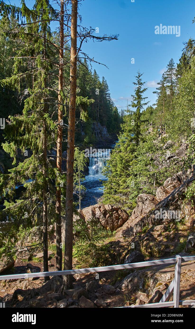 Long multistage flat waterfall. Seething waves and water falling on ...