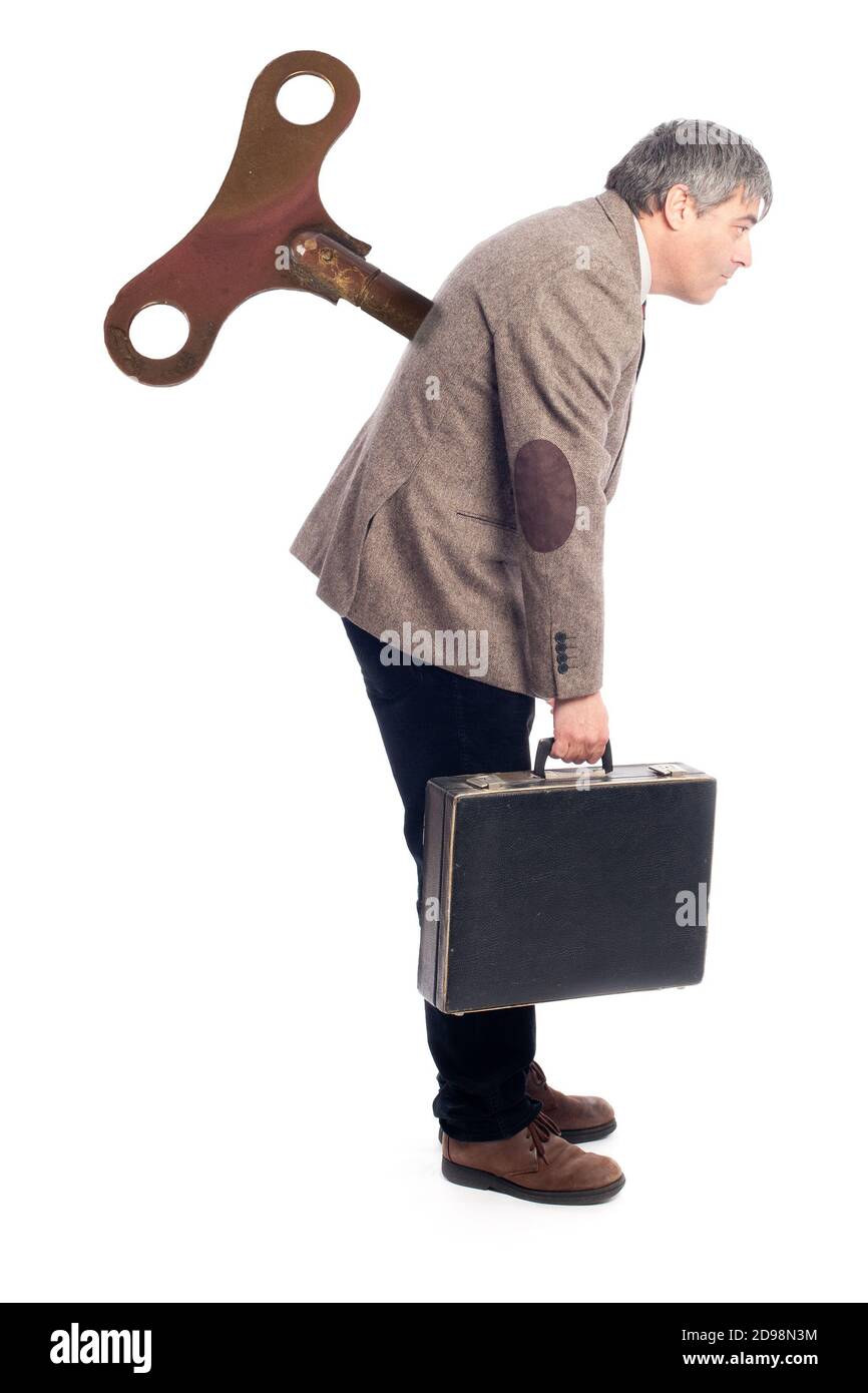 businessman with a wind up key in his back on white background Stock ...