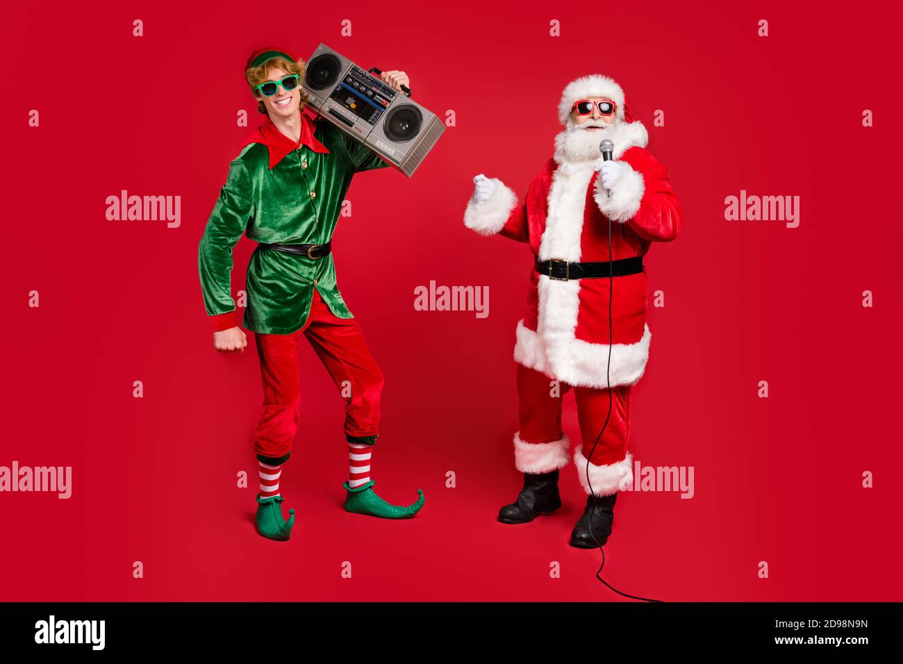 Photo of two people elf hold boombox santa hold mic wear x-mas costume ...