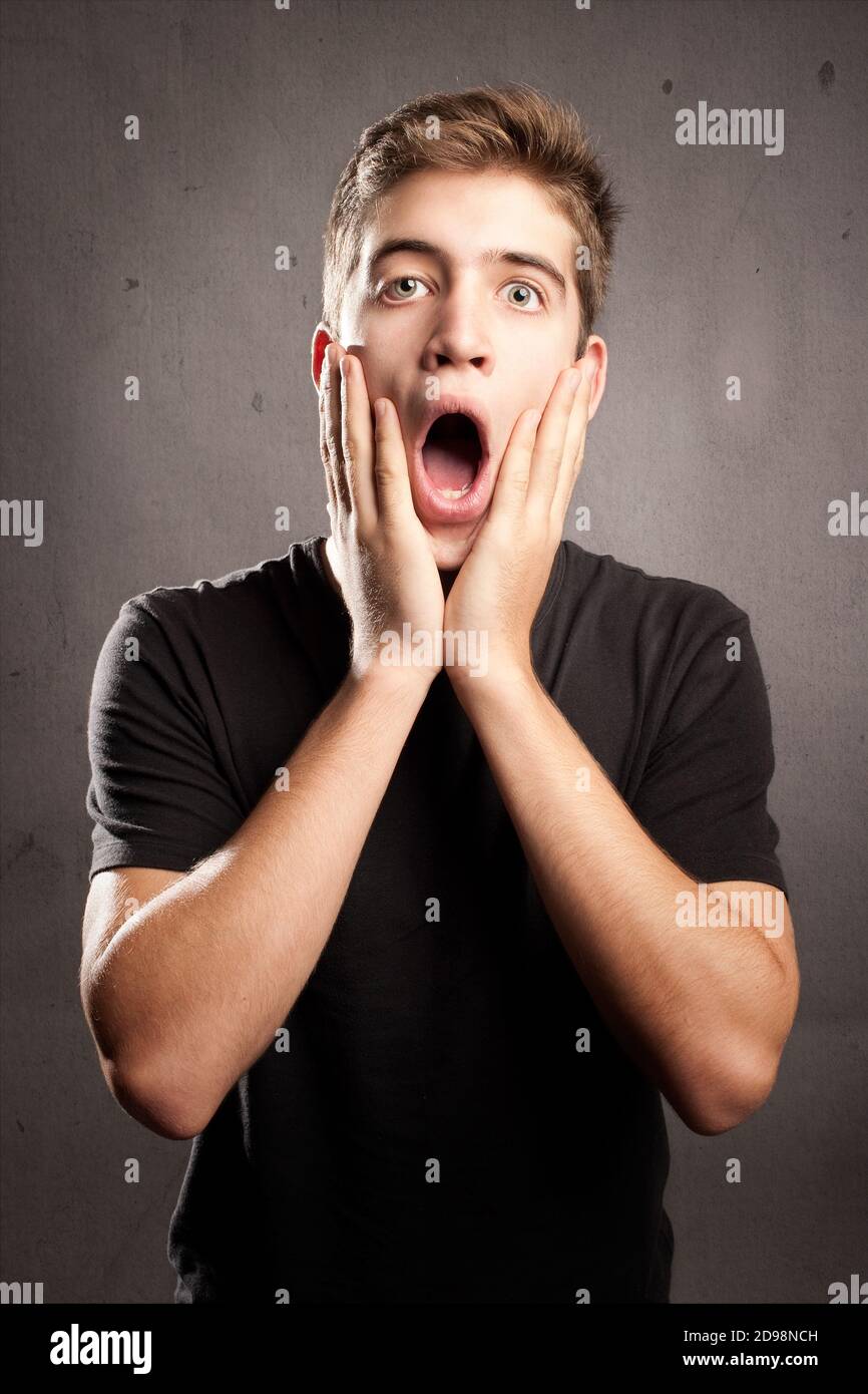 portrait of young man with surprise expression Stock Photo - Alamy