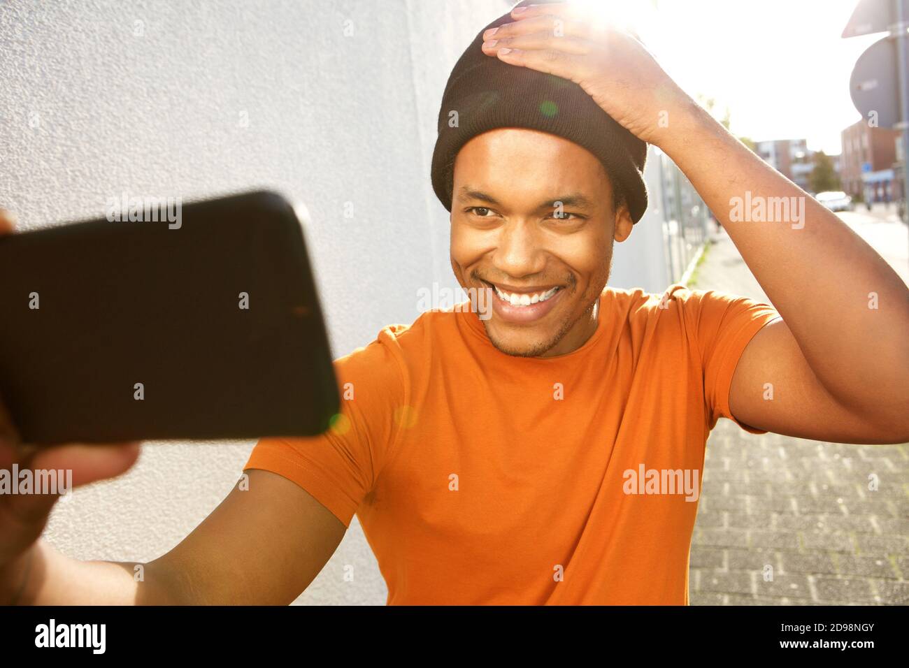 Portrait Of Handsome Young Black Man Taking Selfie With Mobile Phone On