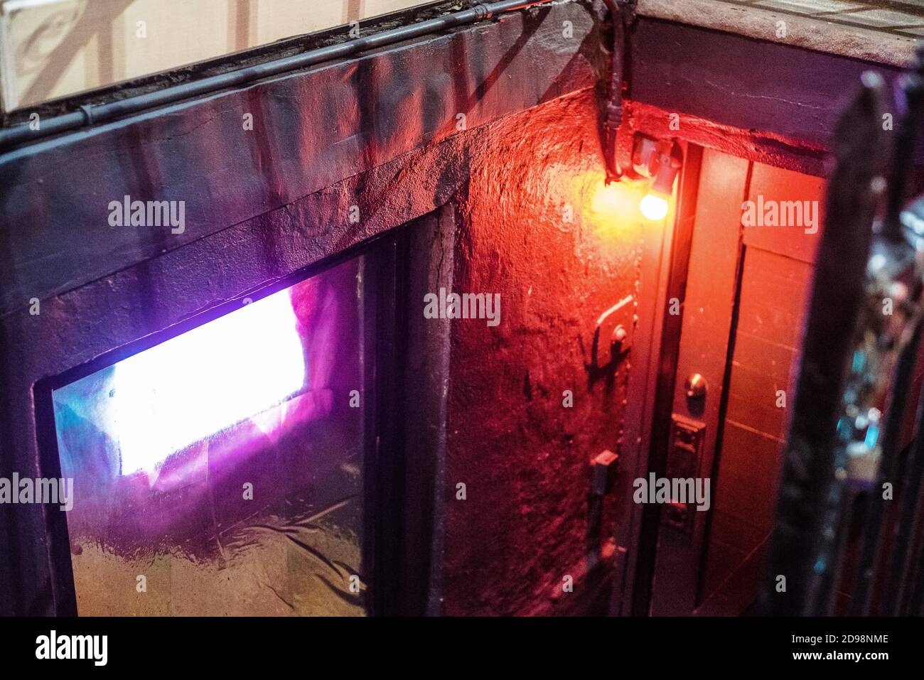 Red light on basement's door Stock Photo - Alamy