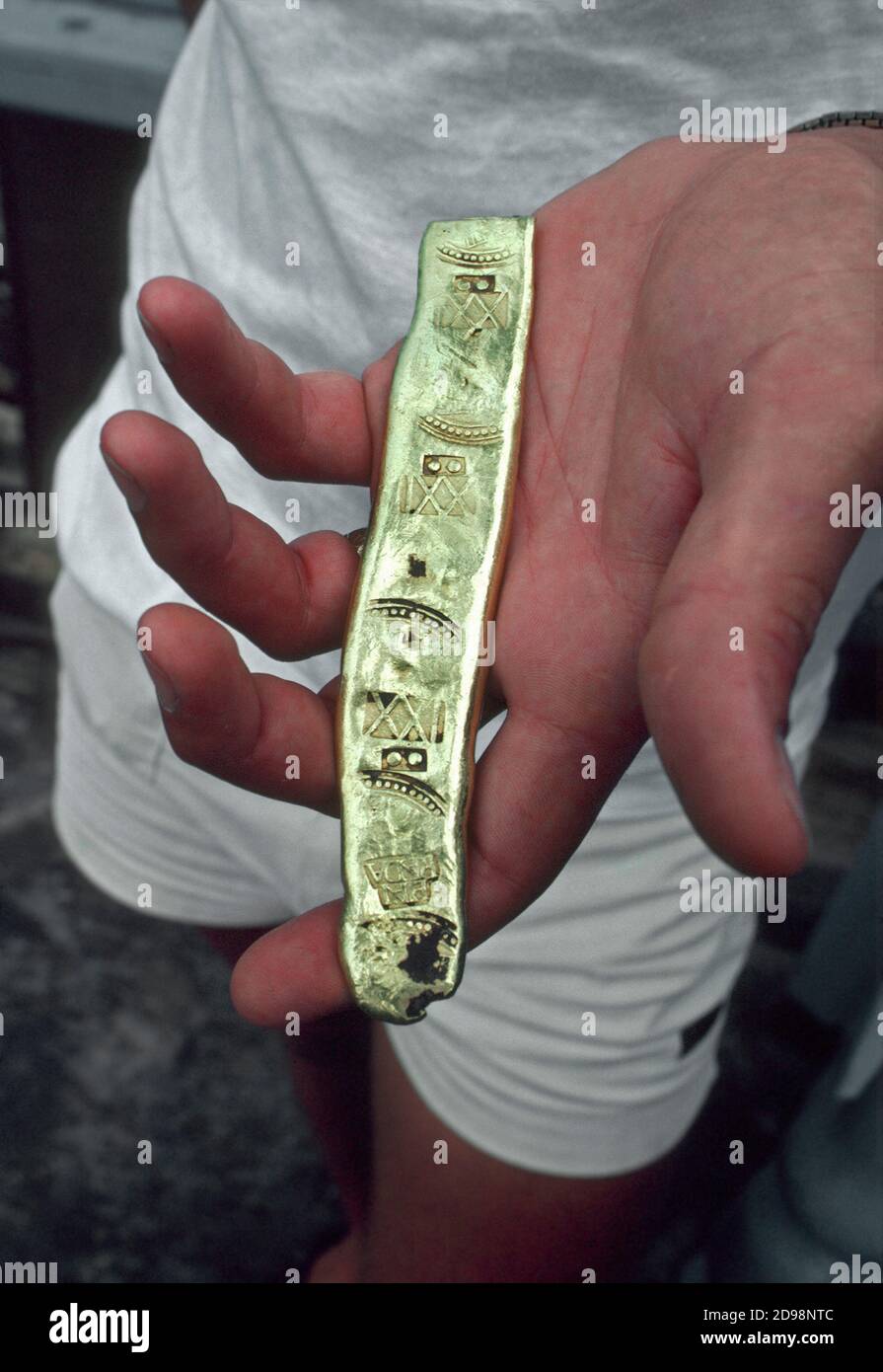 Gold Bar from the sunken Spanish Wreck, Atocha, is held by a member of ...