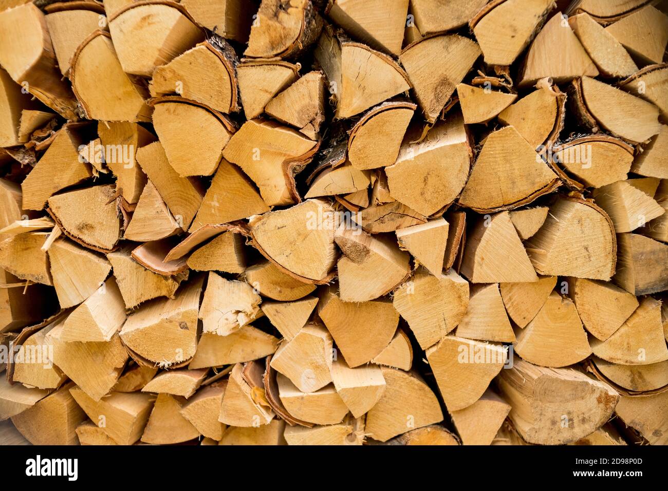 Pile of stacked triangle firewood prepared for fireplace and boiler.dry ...