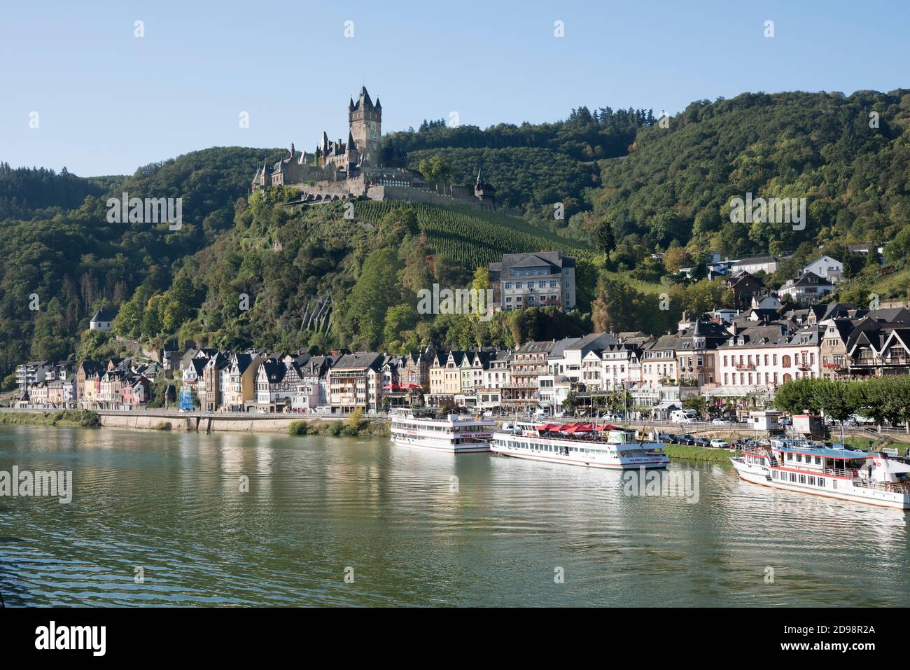 The beautiful Reichsburg Cochem (Cochem Imperial Castle) with village ...
