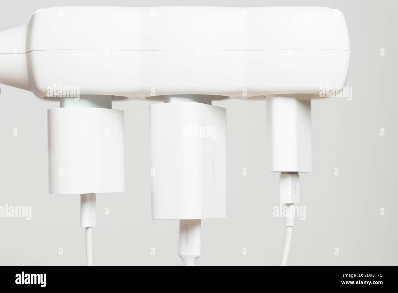 Indoor white office extension cord with three white connected to it ...