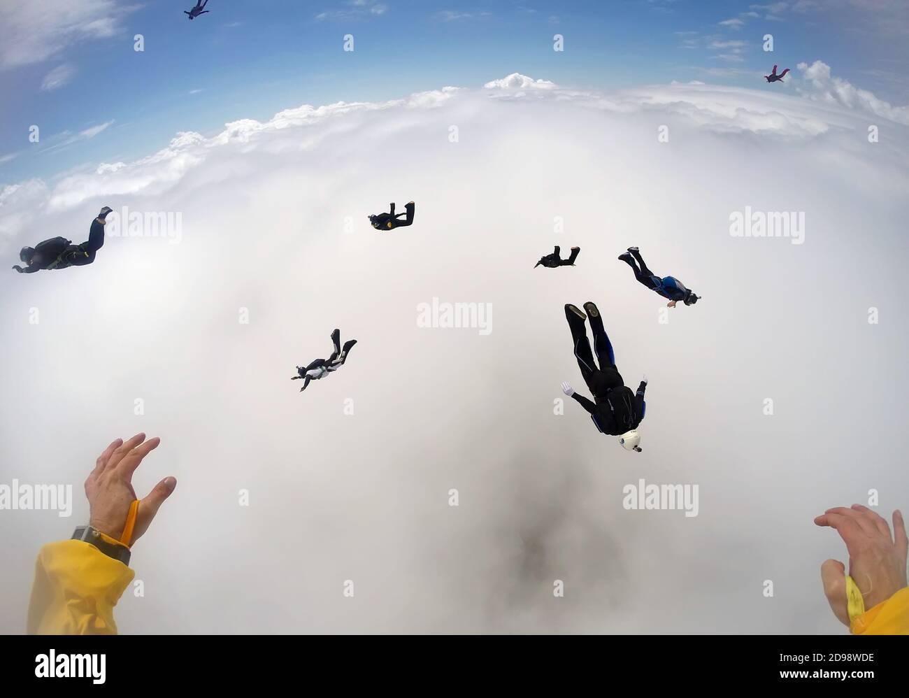 Skydiving group formation with clouds Stock Photo - Alamy