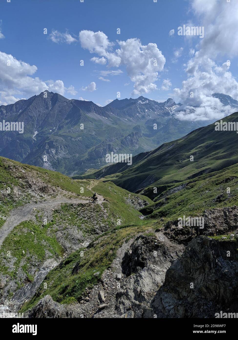 A scenic view of Alpine mountains on a beautiful sunny day. Rocky hills ...