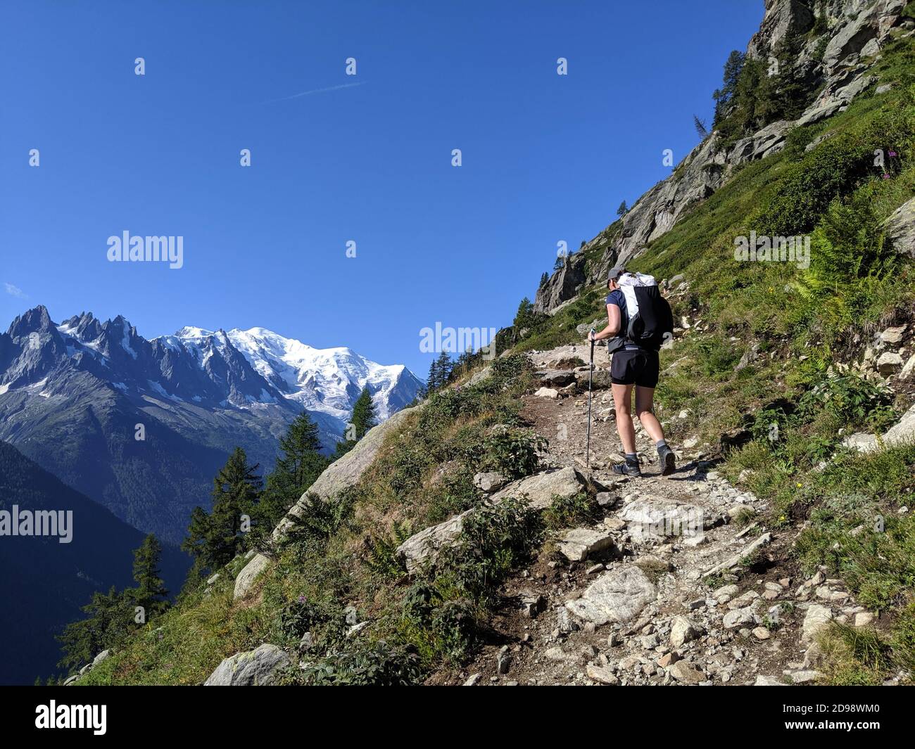 A scenic view of Alpine mountains on a beautiful sunny day. Rocky hills ...