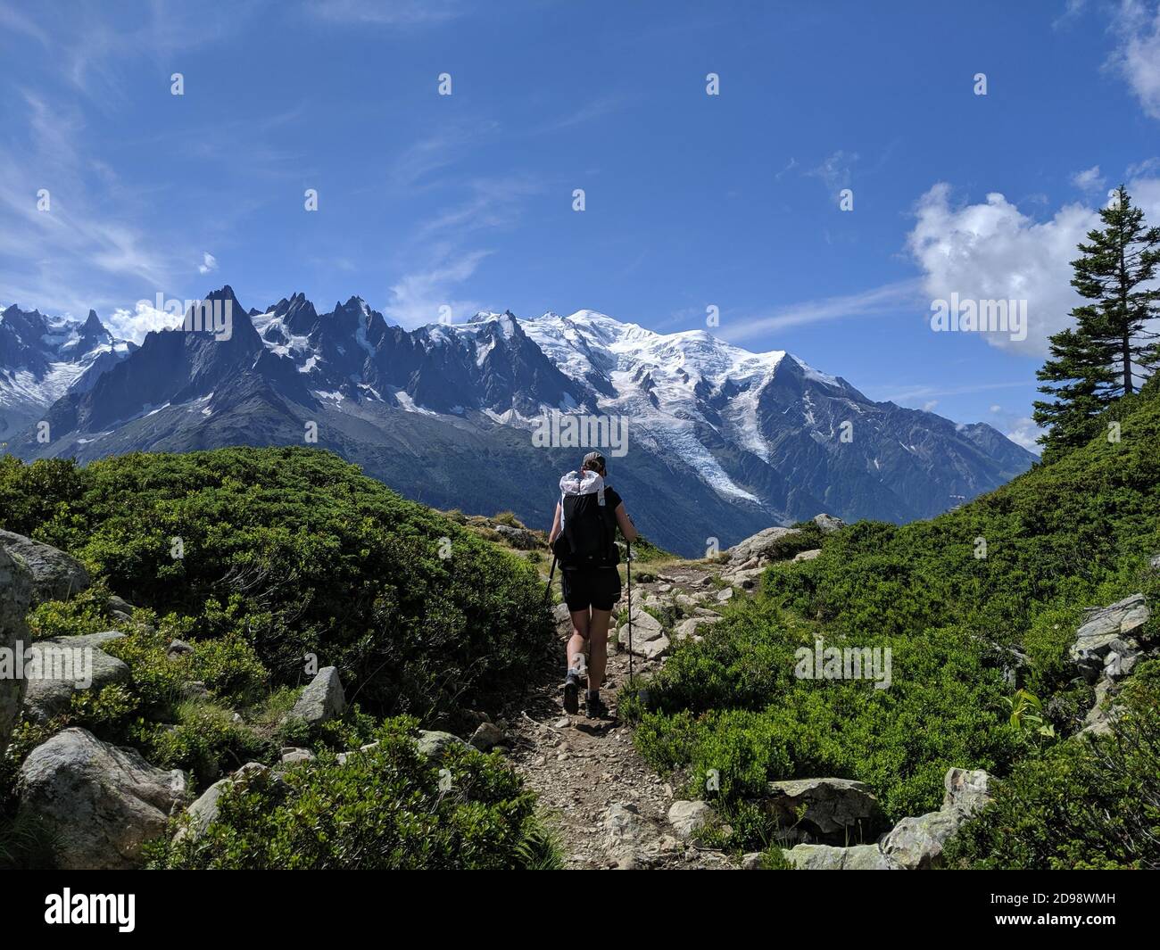 A scenic view of Alpine mountains on a beautiful sunny day. Rocky hills ...