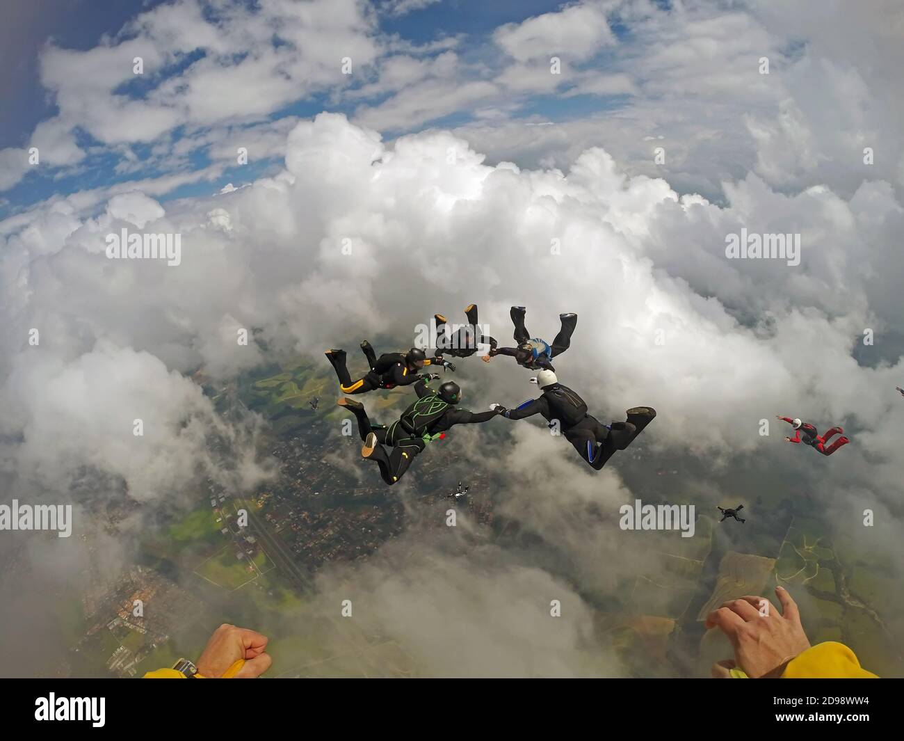 Skydiving group formation with clouds Stock Photo - Alamy