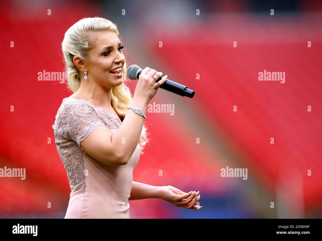 Emily Haig sings the national anthem prior to the beginning of the ...