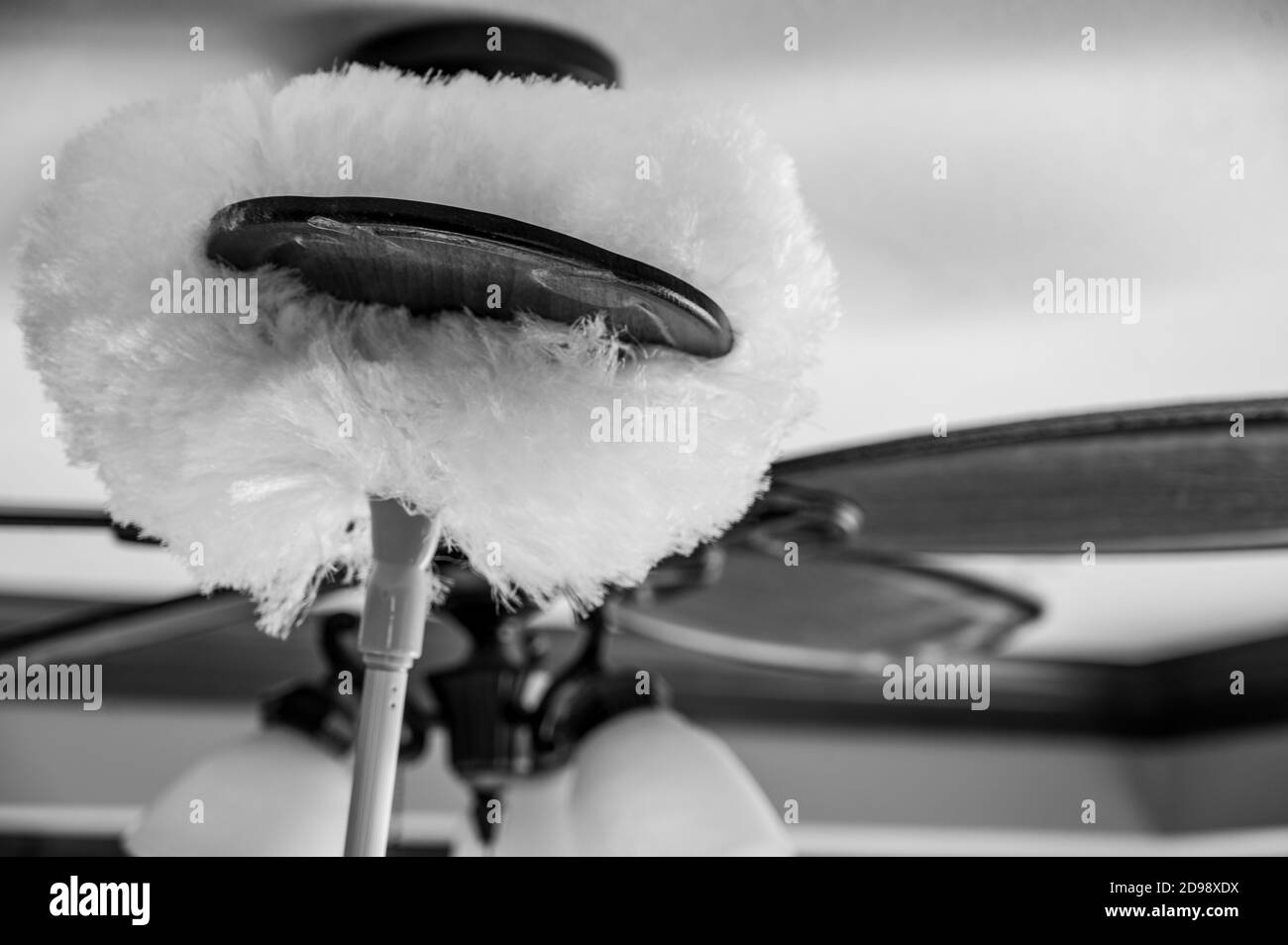 Concept of home cleaning tasks showing buildup of dust on a ceiling fan ...