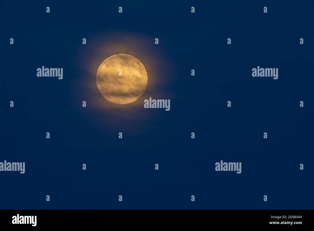 Full moon in the evening sky Stock Photo - Alamy