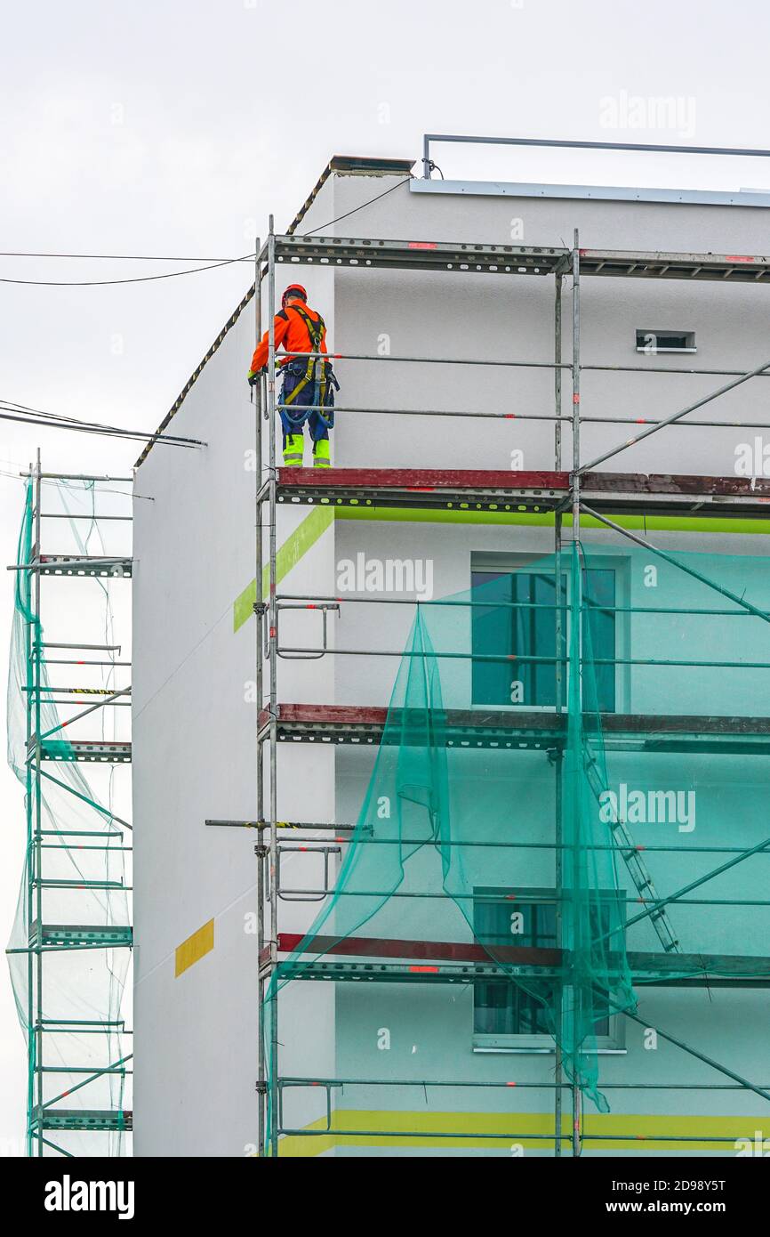 demolition of scaffolding after insulation and renovation of the ...