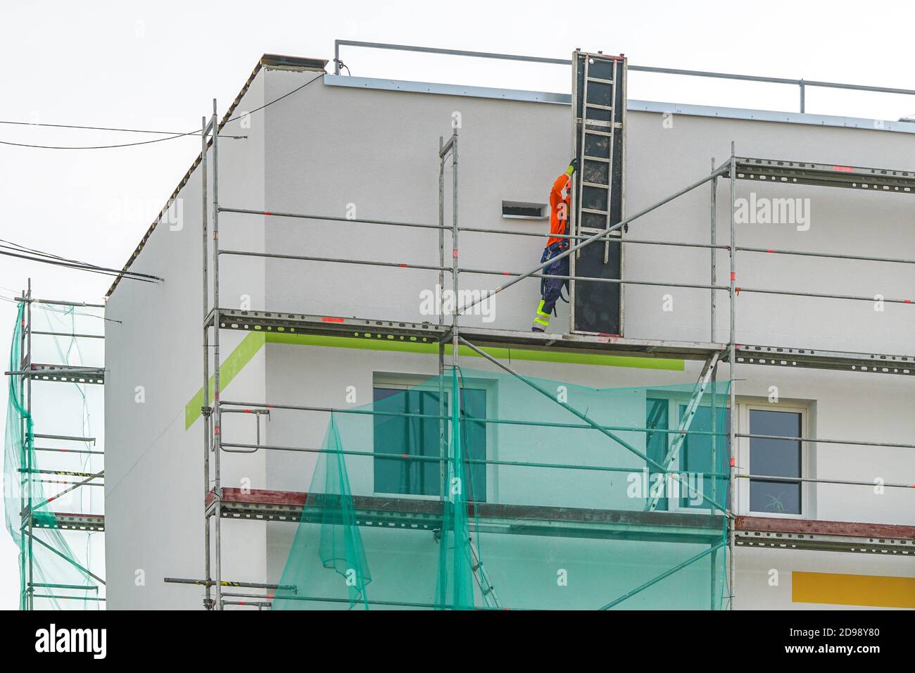 demolition of scaffolding after insulation and renovation of the ...
