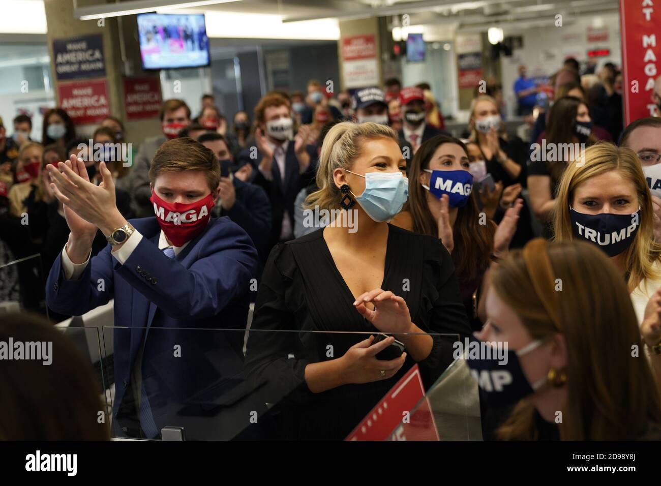 Arlington, Virginia, USA. 03rd Nov, 2020. Campaign workers applaud as ...