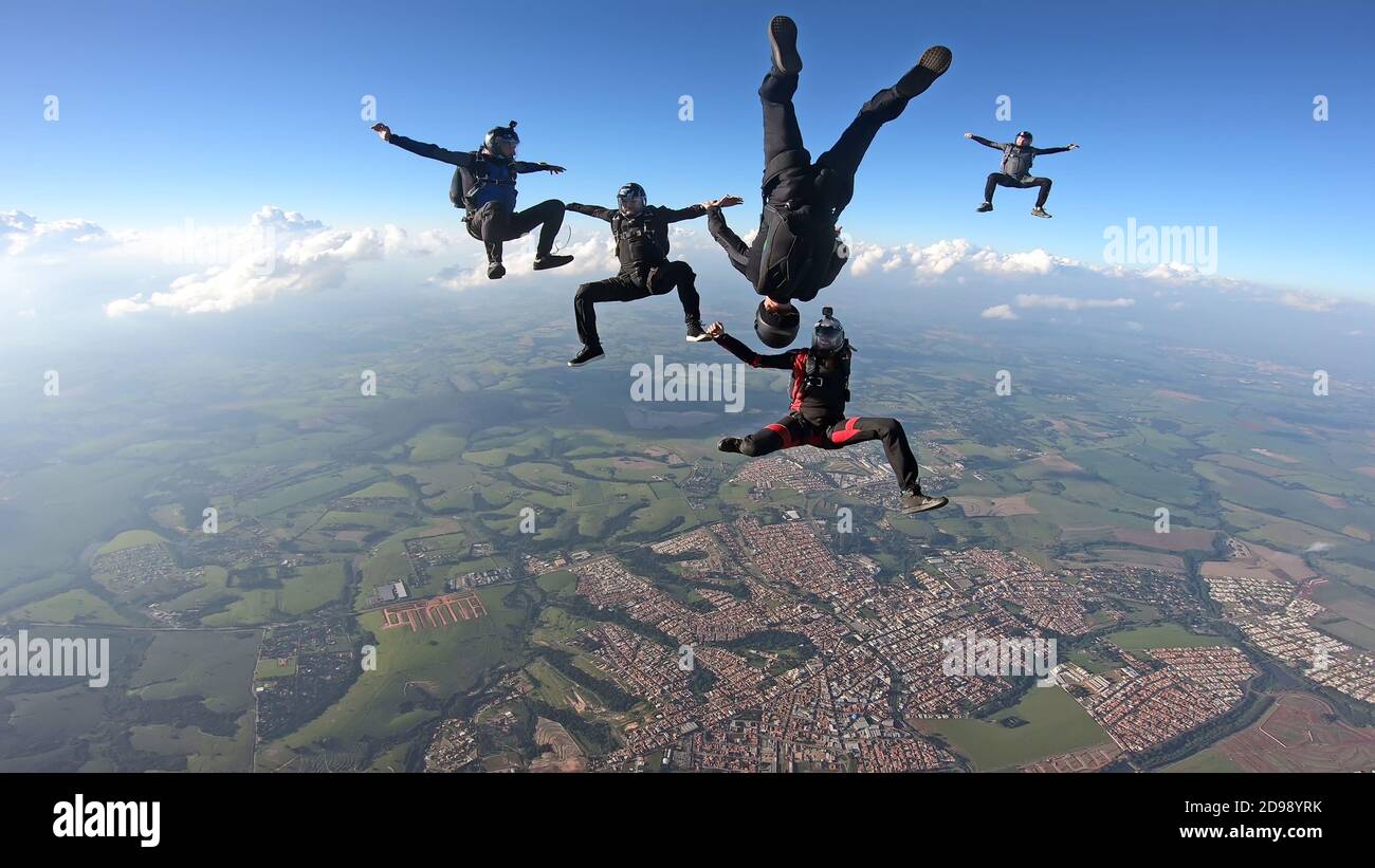 Skydivers having fun jumping out the plane Stock Photo - Alamy