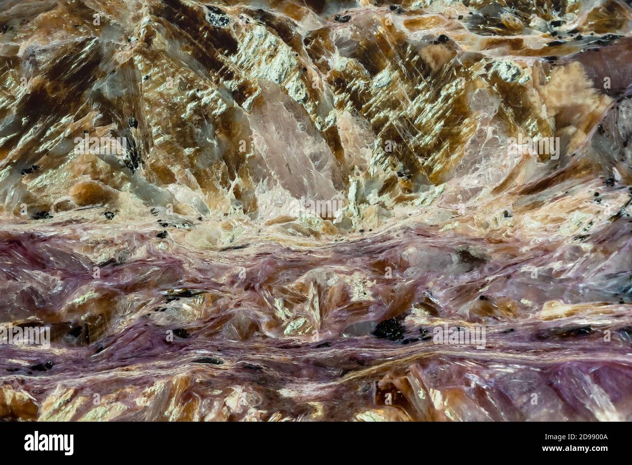 Charoite stone- A stone tile with a pattern that looks like a purple ...