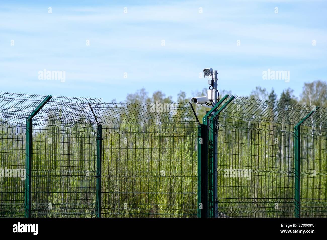 CCTV cameras on the fence Stock Photo - Alamy